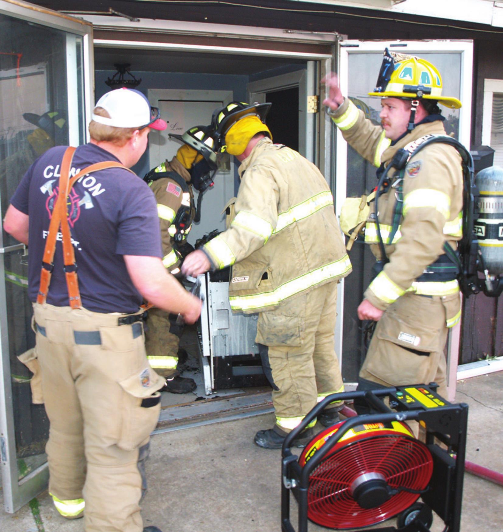 Cleaning up after fire | Clinton Daily News
