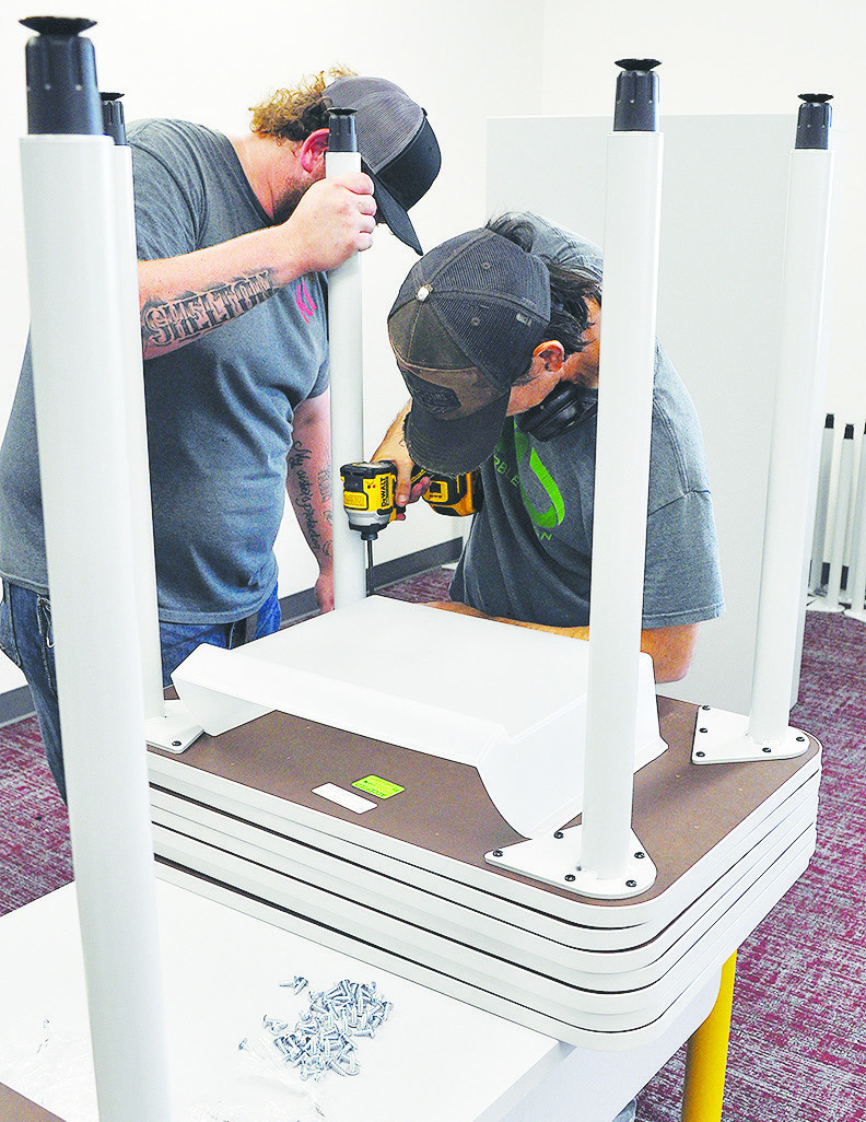 Assembling desk | Clinton Daily News