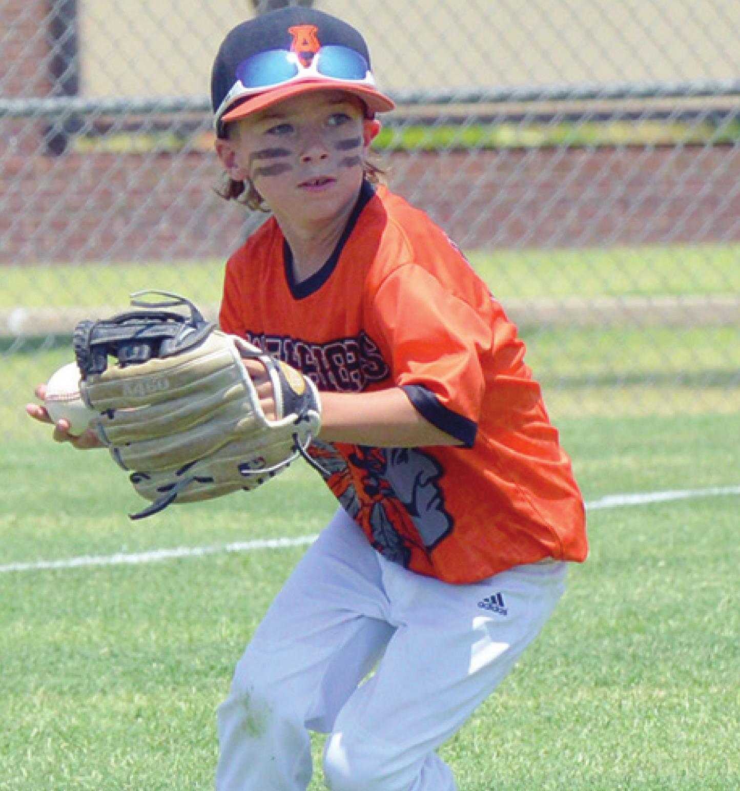 Throwing to first base | Clinton Daily News